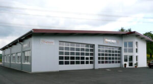 Werkstatthallen aus Stahl vom Profi bauen - Sybac Hallenbau